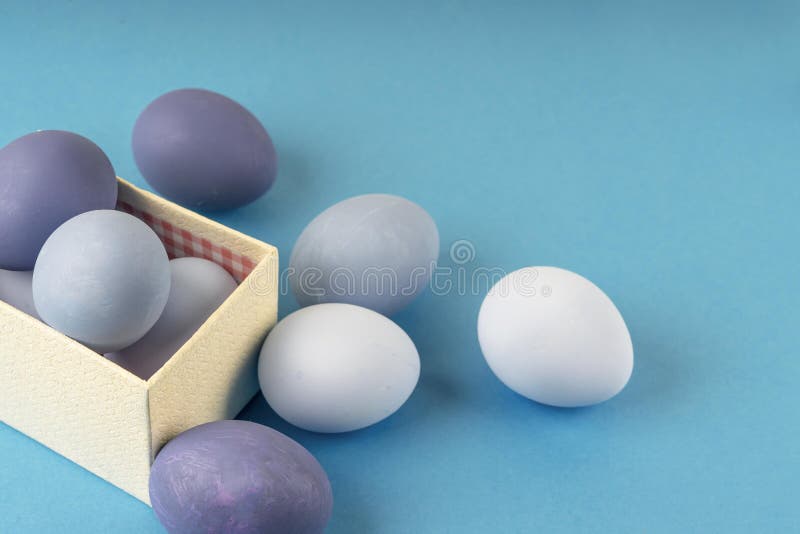 Lots of Blue and Light Blue Easter Eggs Next To an Open Gift Box ...