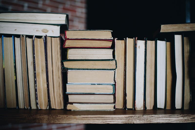 Lots of Books Sideways on a Shelf in the Library Stock Photo - Image of ...