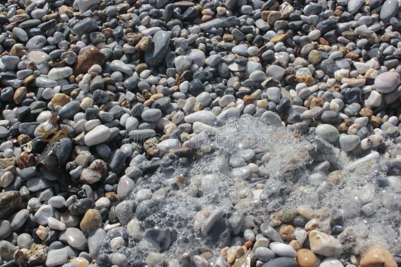 Lots of Bubbles on the Beach Pebbles Stock Photo - Image of stony ...