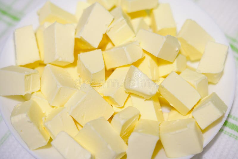 Lots of Butter, Cut into Pieces Stock Photo - Image of food, plate ...
