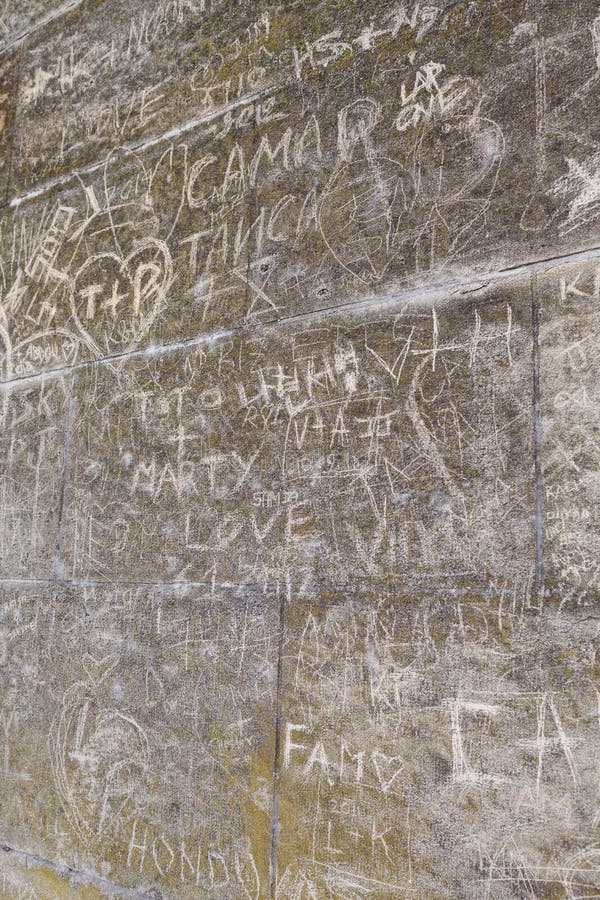 Lots of Carvings Initials Symbols Tags on Old Wall Stock Image - Image ...