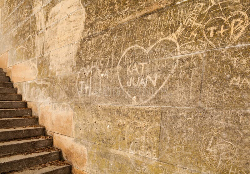 Lots of Carvings Initials Symbols Tags on Old Wall Stock Image - Image ...