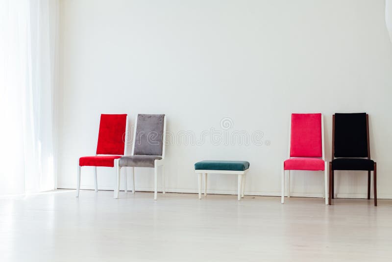 Lots of Chairs of Different Colors in the Interior of the White Room ...