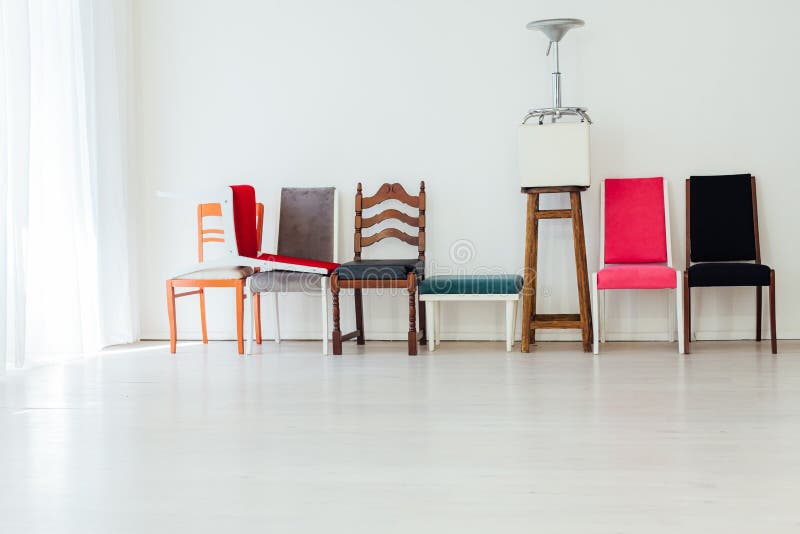 Lots of Chairs of Different Colors in the Interior of the White Room ...