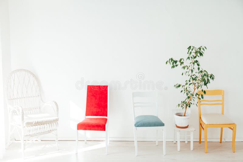 Lots of Chairs of Different Colors in the Interior of the White Room ...