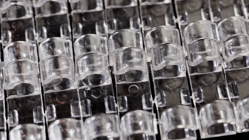 Lots of Clear Plastic Wire Holders on the Black Surface. Stock Footage ...