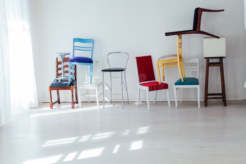 Lots of Different Chairs in the Interior of an Empty White Room Stock ...