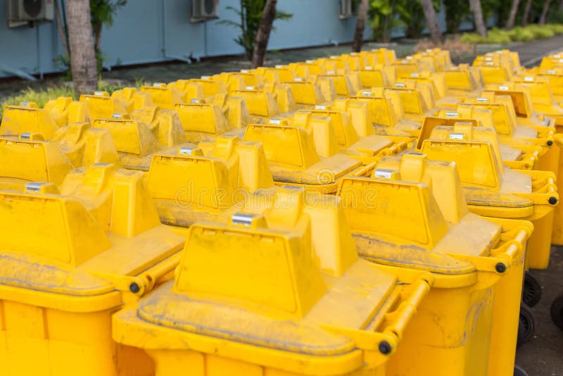 A Lots of Dirty Yellow Trashcan Stock Photo - Image of garbage ...