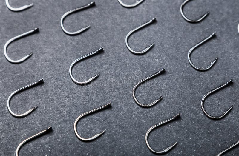 Lots of Fishing Hooks on Black Background Stock Photo - Image of black ...
