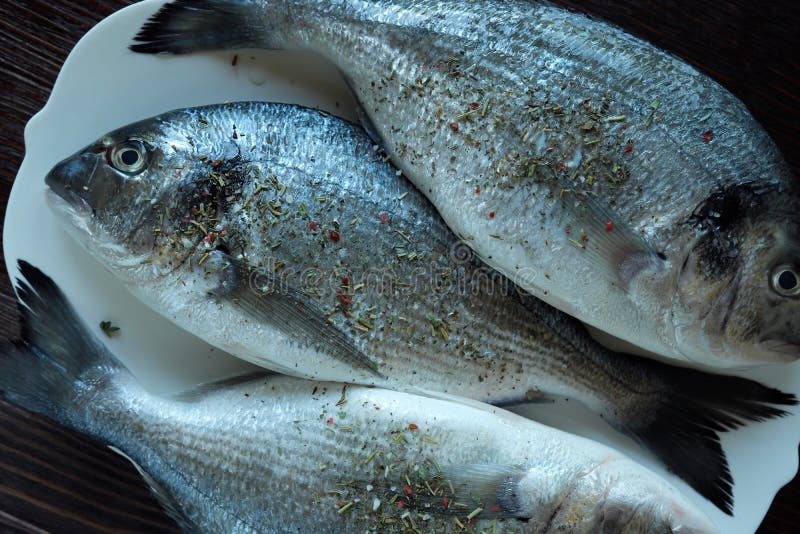 Lots of Fresh Fish on the Plate for Cooking Stock Photo - Image of wood ...