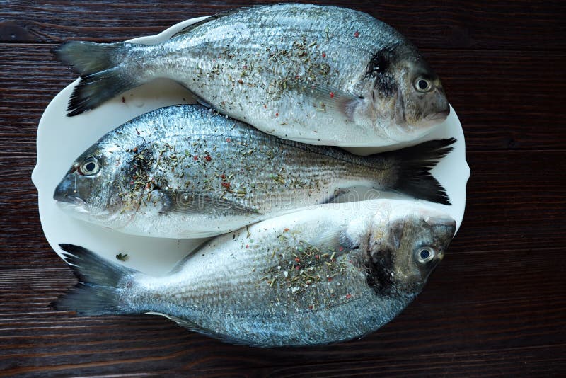 Lots of Fresh Fish on the Plate for Cooking Stock Photo - Image of wood ...