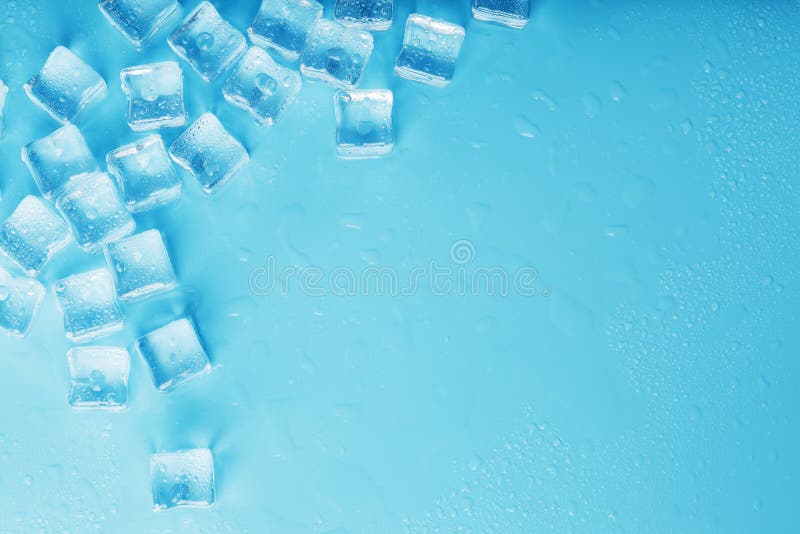 Lots of Ice Cubes with Water Drops Scattered on a Blue Background Stock ...