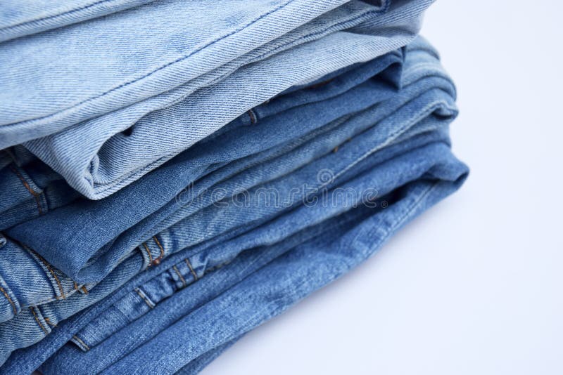 Lots of Jeans Pants in a Stack. Denim Background Stock Photo - Image of ...