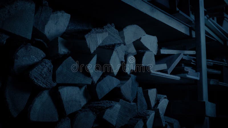 Pile of Logs Burning in Front of a Campfire with Glowing Embers on a ...