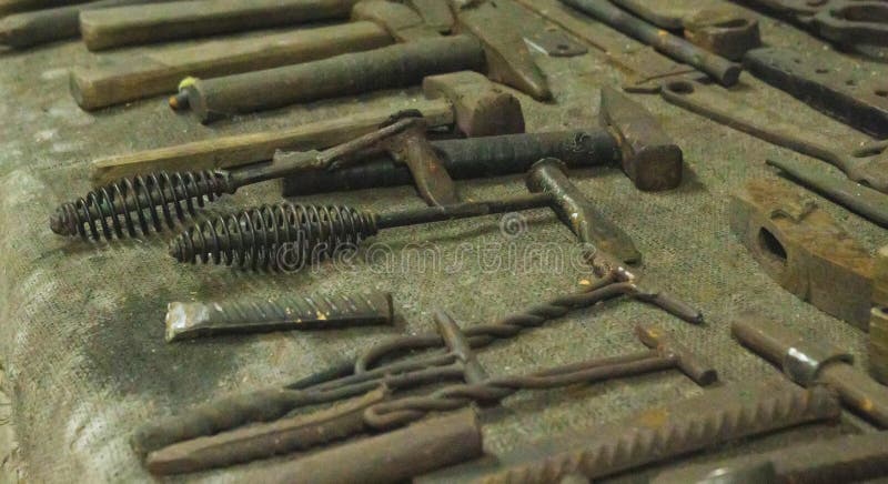 Lots of Metal Tools To Work in the Forge. Background, Industry Stock ...