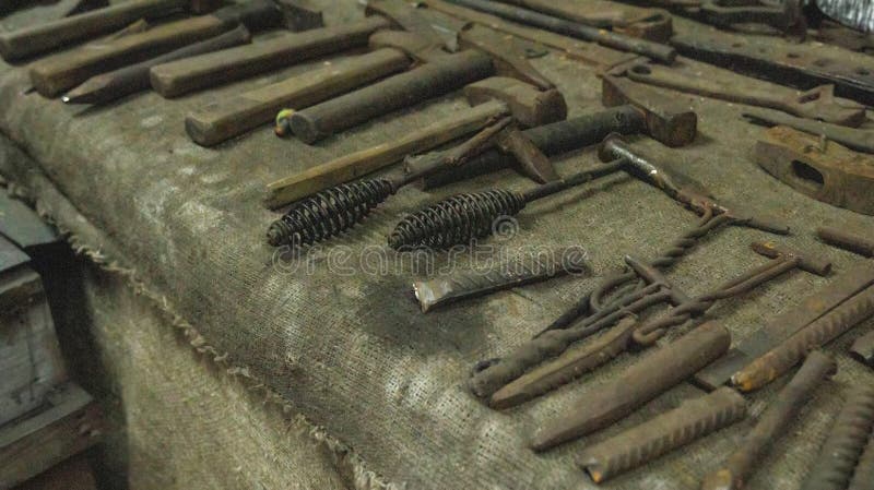 Lots of Metal Tools To Work in the Forge. Background, Industry Stock ...