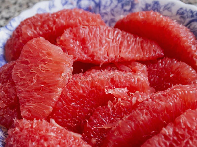 Lots of Peeled Grapefruit Pieces on a Plate Stock Photo - Image of ...