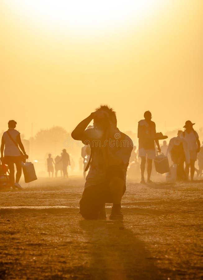 Lots of people in the dust stock image. Image of colorful - 51109797