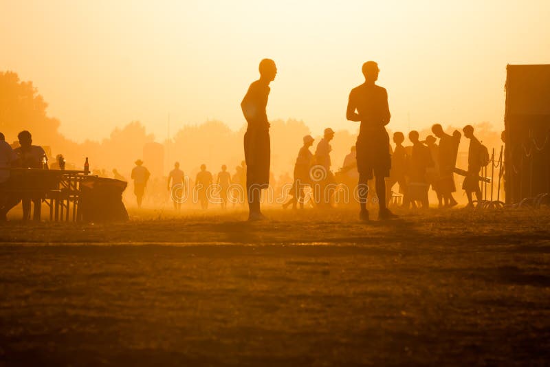 Lots of people in the dust stock image. Image of colorful - 51109797