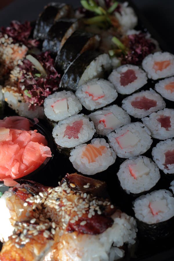 Lots of pieces of sushi stock image. Image of ginger - 240839263