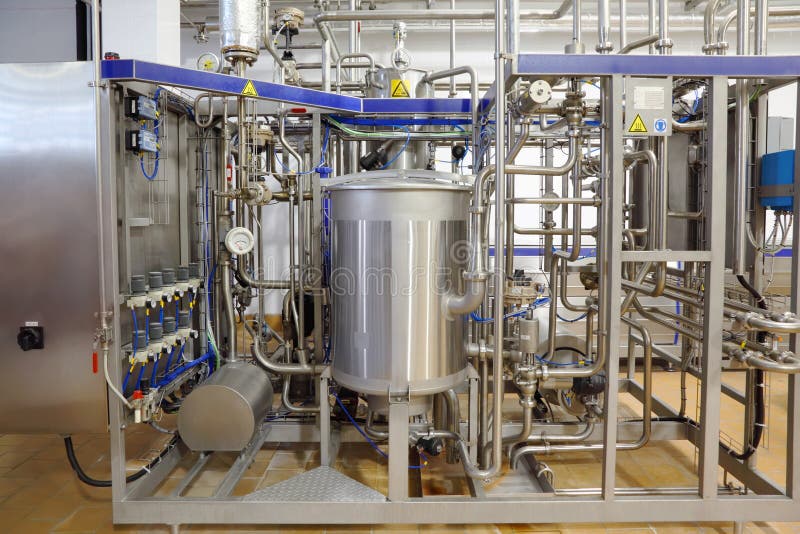 Lots of Pipes and Reservoirs in Lit Room Stock Photo - Image of ...