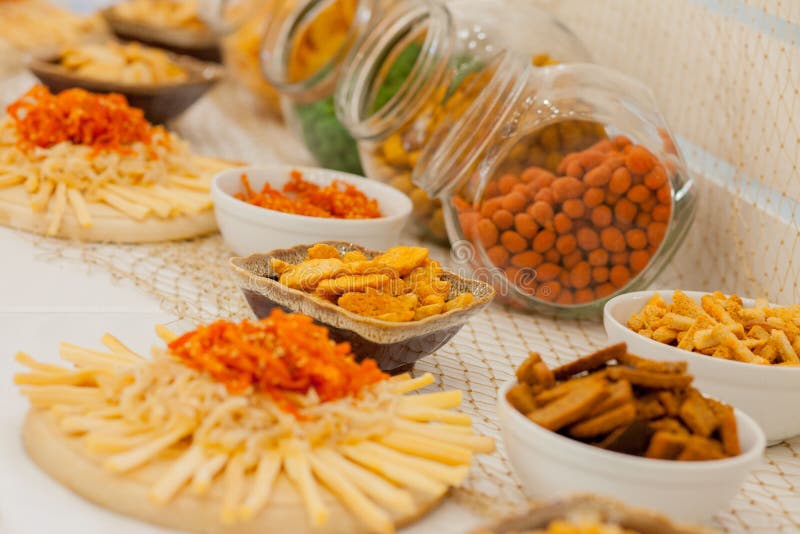 A Lots of Salty Snacks on a Table, Many Cheese and Crackers on the ...