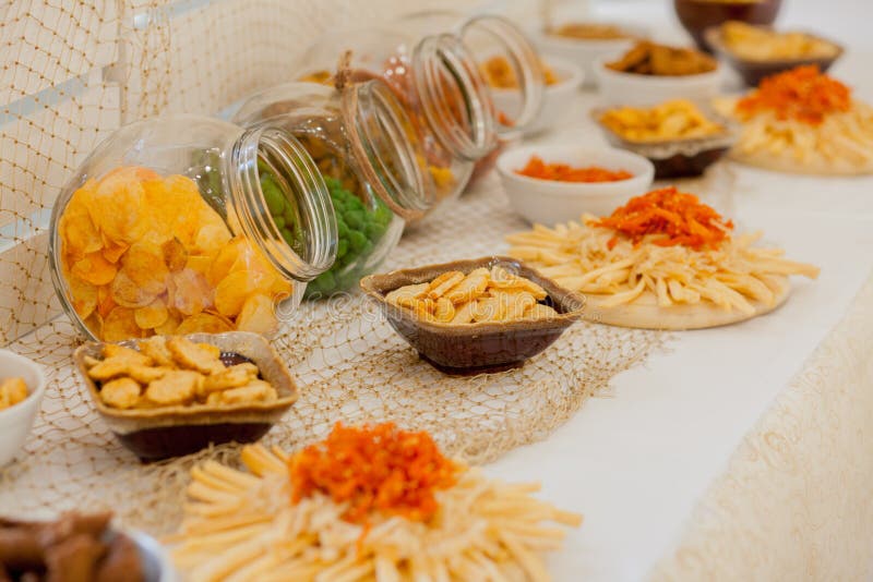 A Lots of Salty Snacks on a Table, Many Cheese and Crackers on the ...