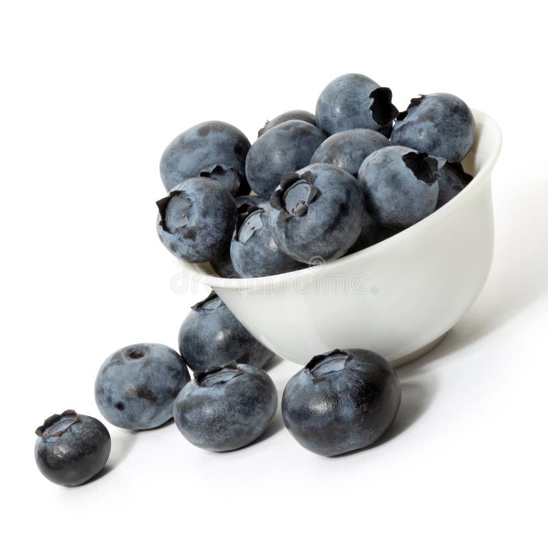 Lots of Scattered Blueberry in a White Cup on a White Background. Full ...
