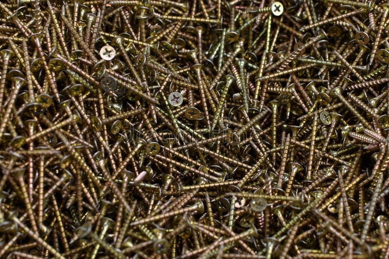 Lots of Small Gold-colored Brass Screws. Close-up. Texture. Background ...