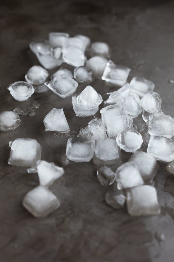 Lots of Small Pieces of Ice on a Brown Table Stock Image - Image of ...