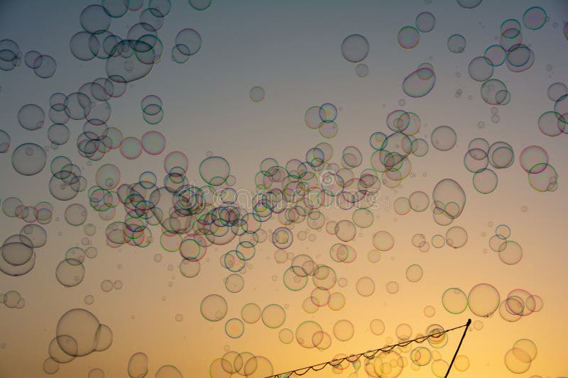 Lots of Soap Bubbles in the Sky at Sunset with Soap Bubble Stick Stock Image - Image of ...