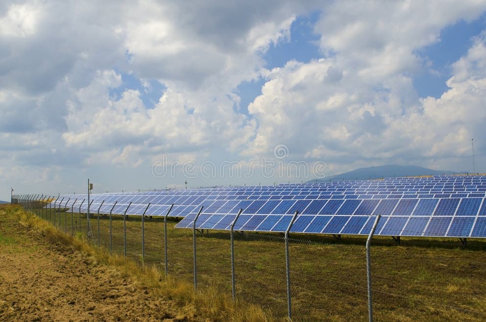 Lots of Solar Panels Behind Rusty Barbed Wire Stock Photo - Image of ...
