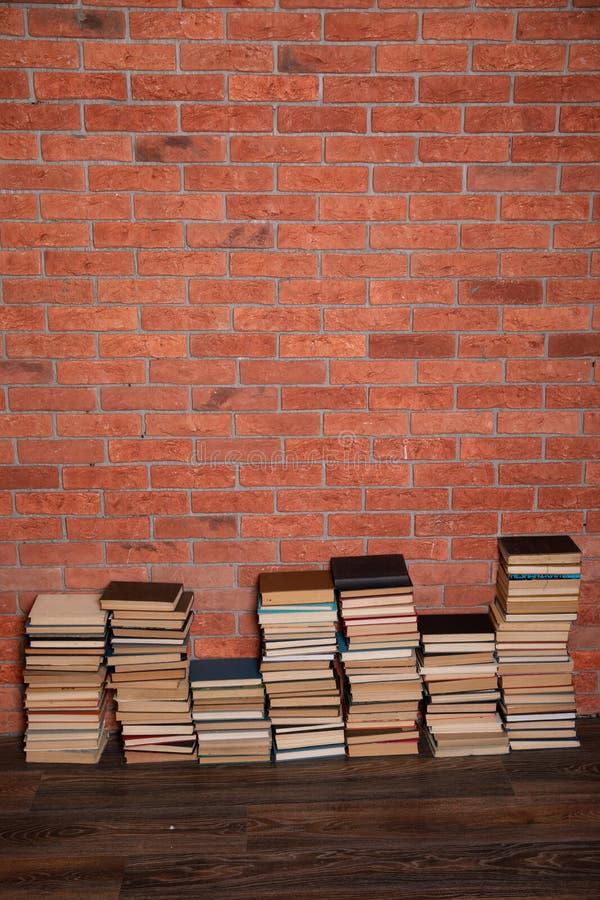 Lots of Stacks of Old Books for Learning by the Brick Wall of the ...