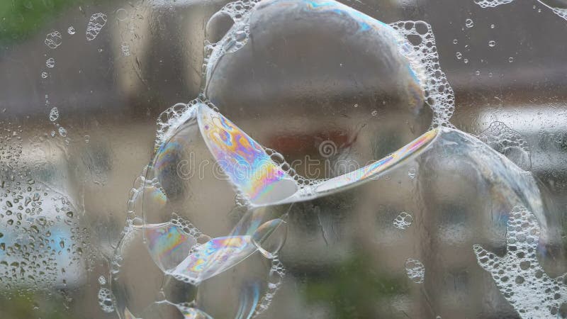 Lots of Sticky Multicolored Soap Bubbles on the Surface of a Wet Rainy ...