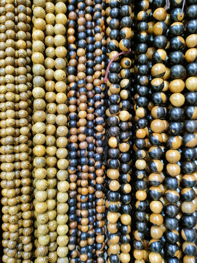 Lots of Threads with Wooden Beads Hanging in Rows on the Wall Stock ...