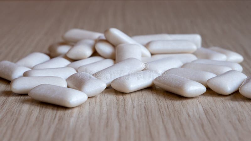 Lots of White Little Bubble Gum Pads on the Table Stock Image - Image ...