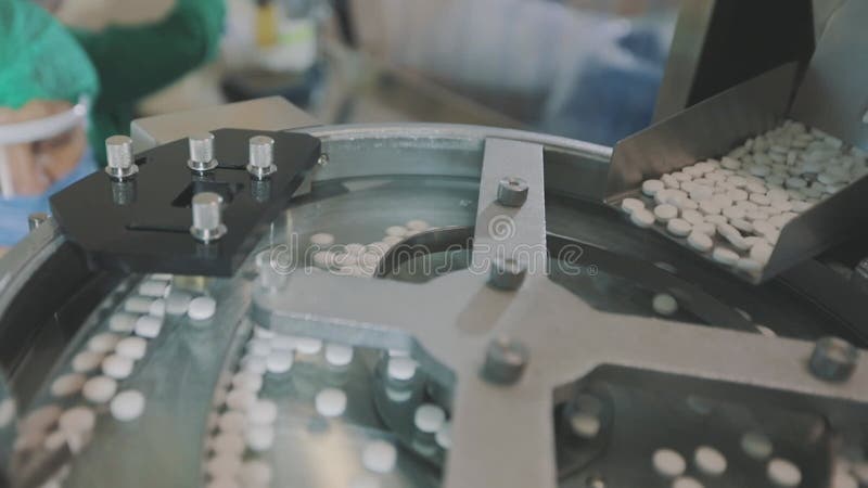 Round White Pills Close Up. Tablet Manufacturing Process Close-up. Lots ...