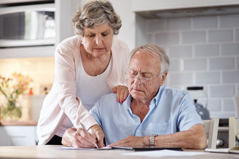 Loud Like Love. an Elderly Couple Going Over Paperwork at Home. Stock ...