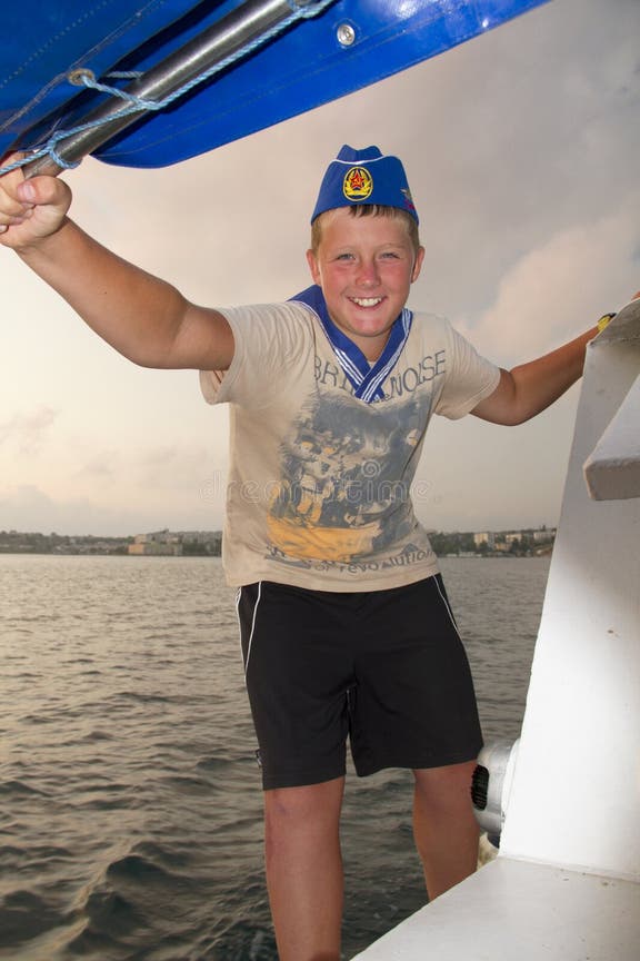 Loughing boy in the sea stock image. Image of elementary - 32986537