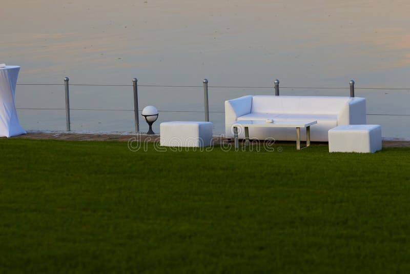 Lounge Area for Guests Outside. White Sofas and Tables Stock Photo ...