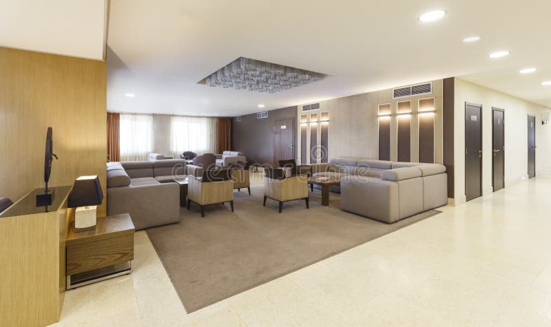 Lounge Area with Large Gray Sofas and Armchairs in Hotel Stock Photo ...
