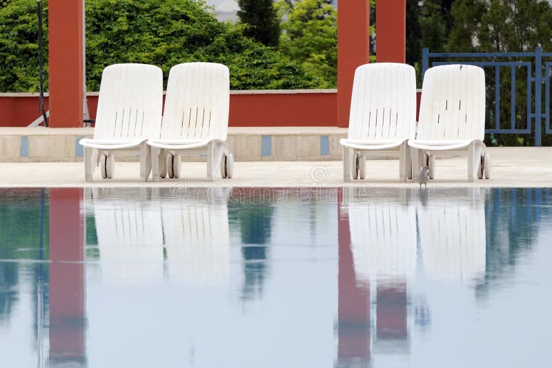 Lounge Chairs Near the Pool Stock Photo - Image of leisure, chair: 14608906