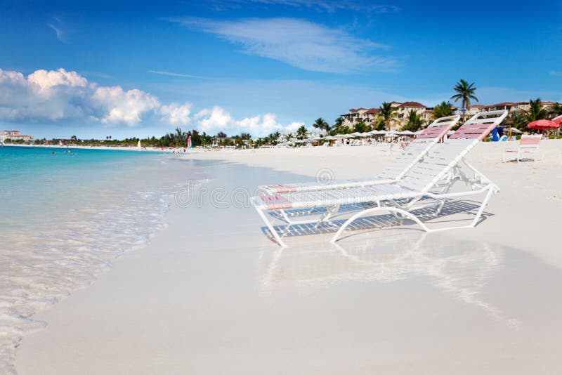 Lounge Chairs on Tranquil Grace Bay Beach Stock Image - Image of edge ...
