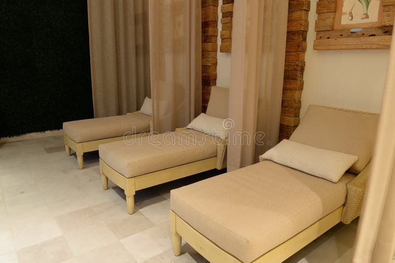 Lounge chairs in spa stock photo. Image of beds, tile - 72288838