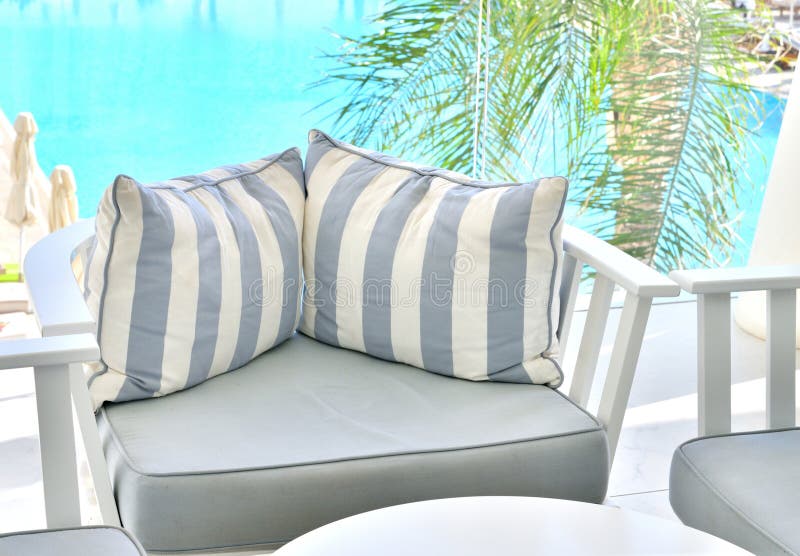 Lounge with Striped Sofas Against the Backdrop of a Pool of Water Stock ...