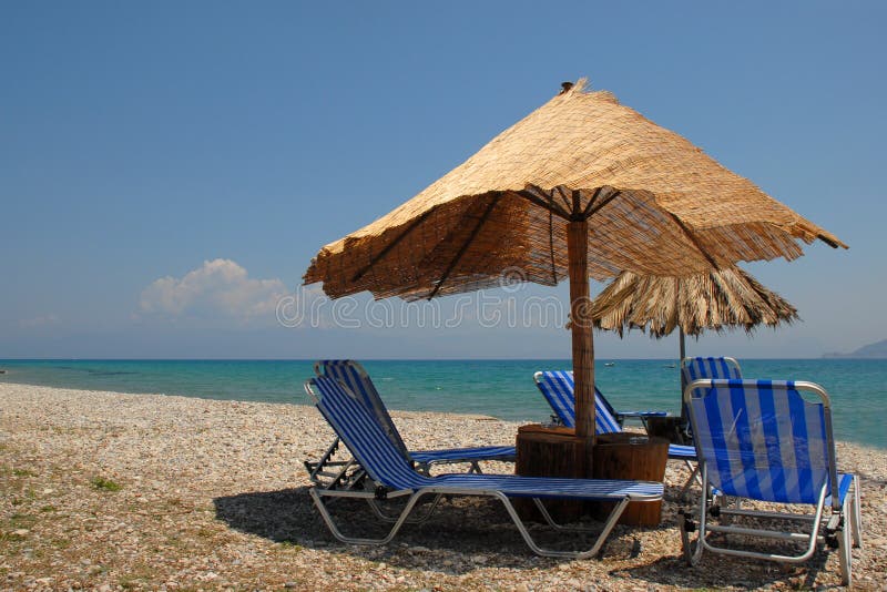 Lounging on the beach stock image. Image of coastline - 3024105