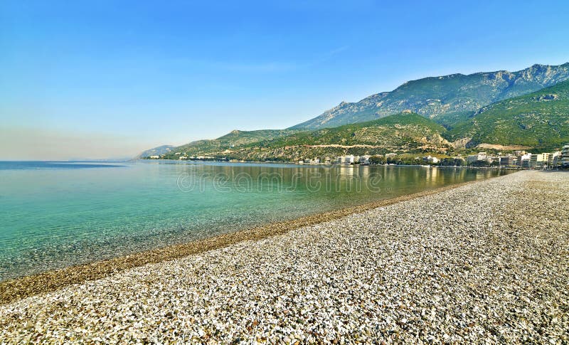 Loutraki beach Greece stock photo. Image of reflections - 71761974