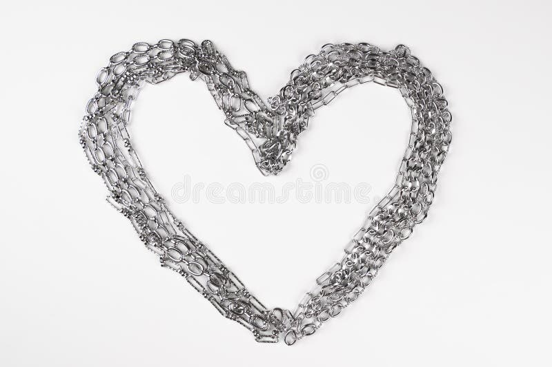 Love. Addiction. Heart Frame Made from a Stell Chain on Pink Surface ...