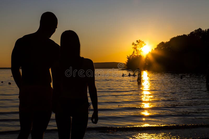 Love at the beach stock image. Image of people, back - 35483471