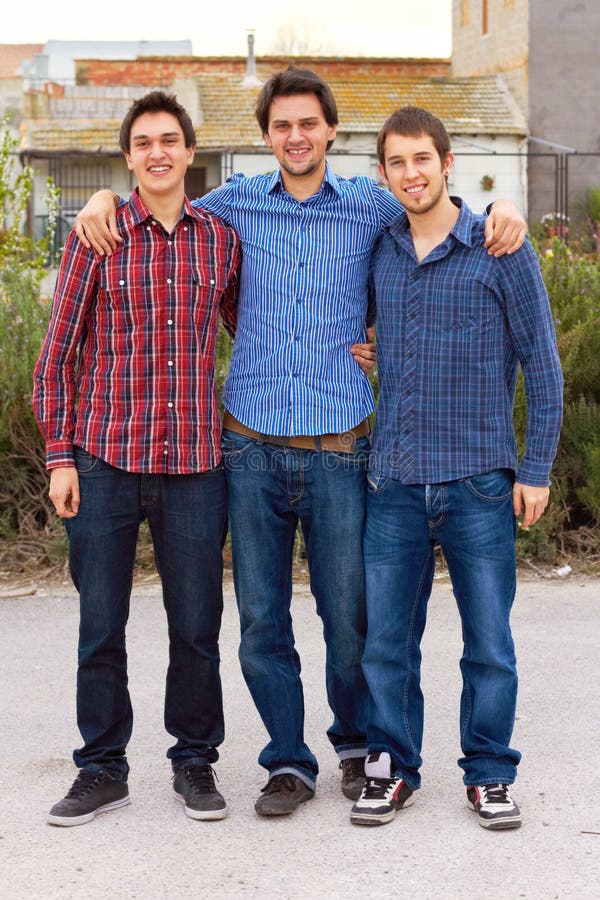 Love between Brothers. Portrait of a Group of Young Men Standing ...